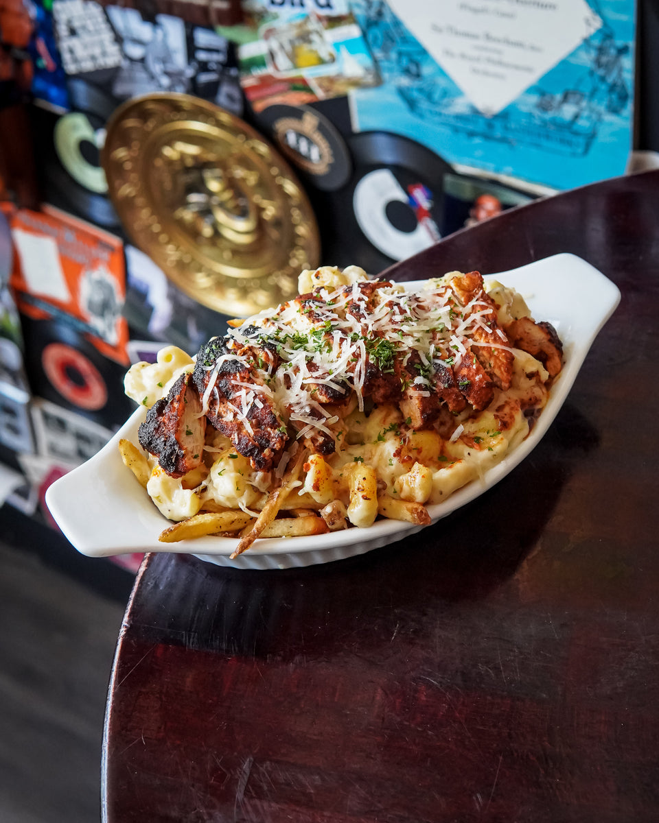 Blackened Chicken Alfredo Poutine (June 17-23) – Leopold's Tavern